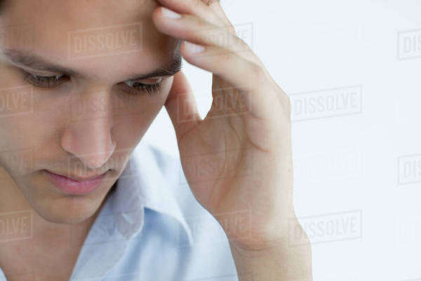 Man with hand on forehead - Royalty-free Stock Photo | Dissolve