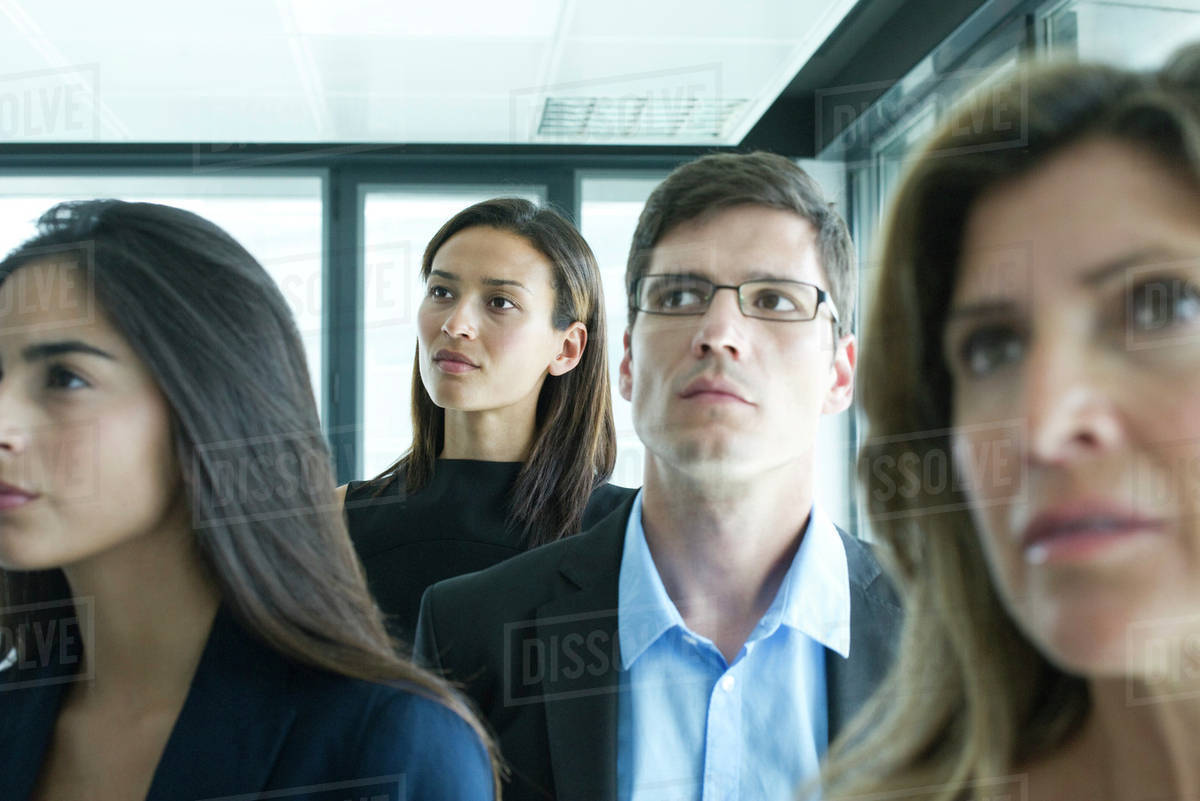 Business associates, focus on woman in background - Royalty-free Stock ...