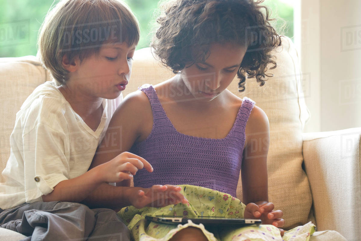 Children using digital tablet - Royalty-free Stock Photo | Dissolve