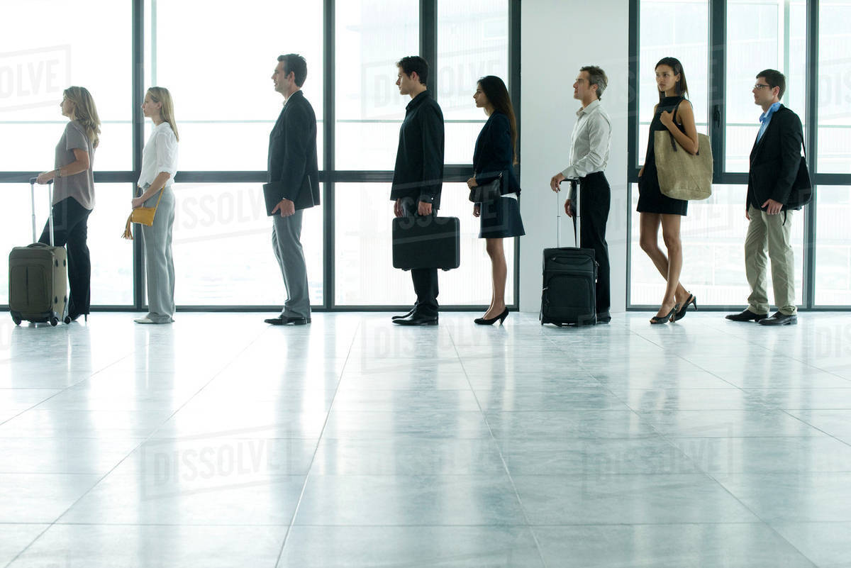 Business people standing in line - Stock Photo - Dissolve