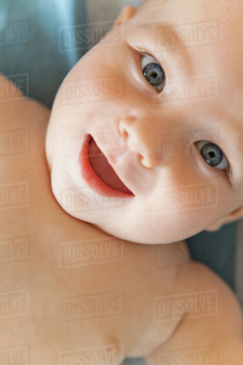 Baby smiling at camera, portrait - Stock Photo - Dissolve