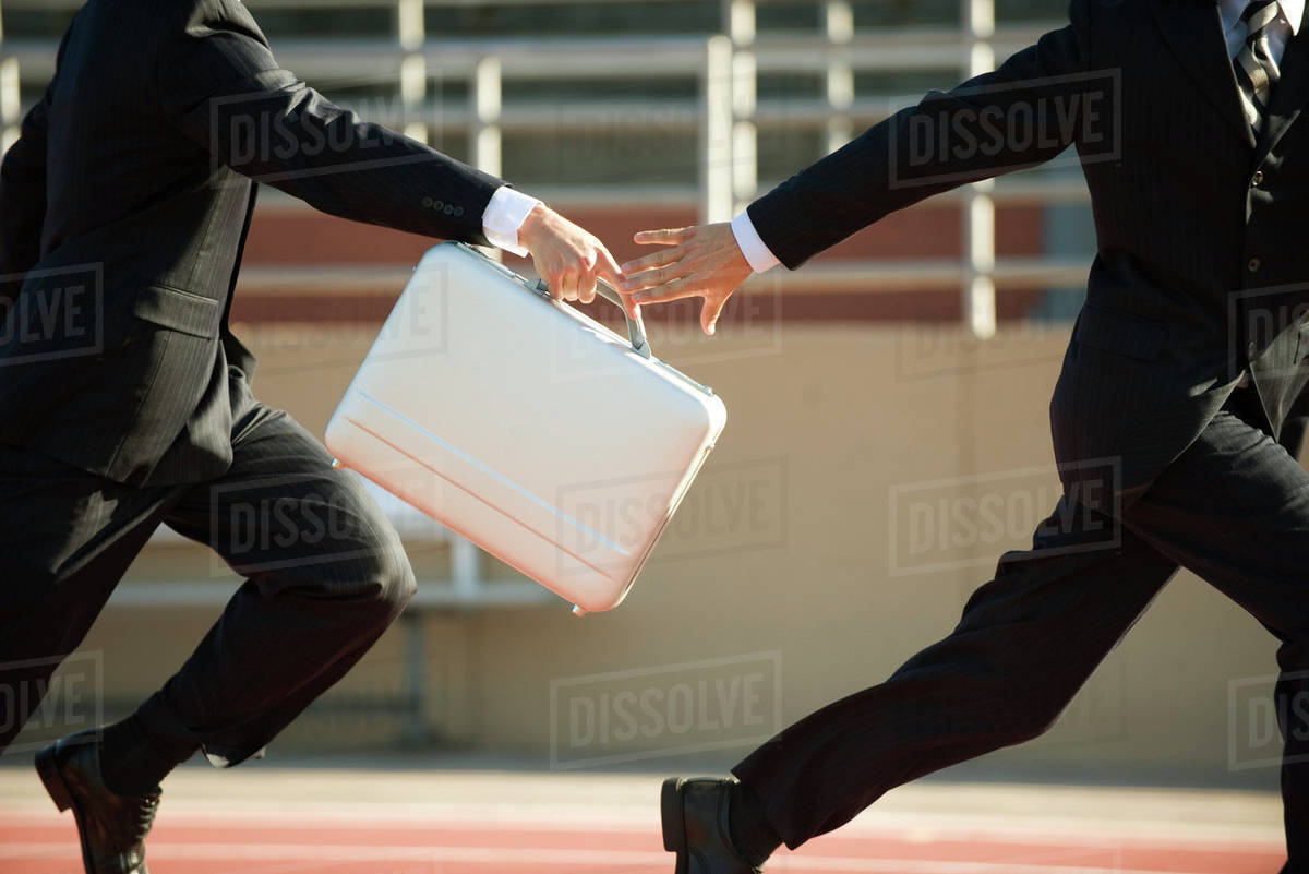 Businessmen running in relay race, handing off briefcase - Royalty-free ...
