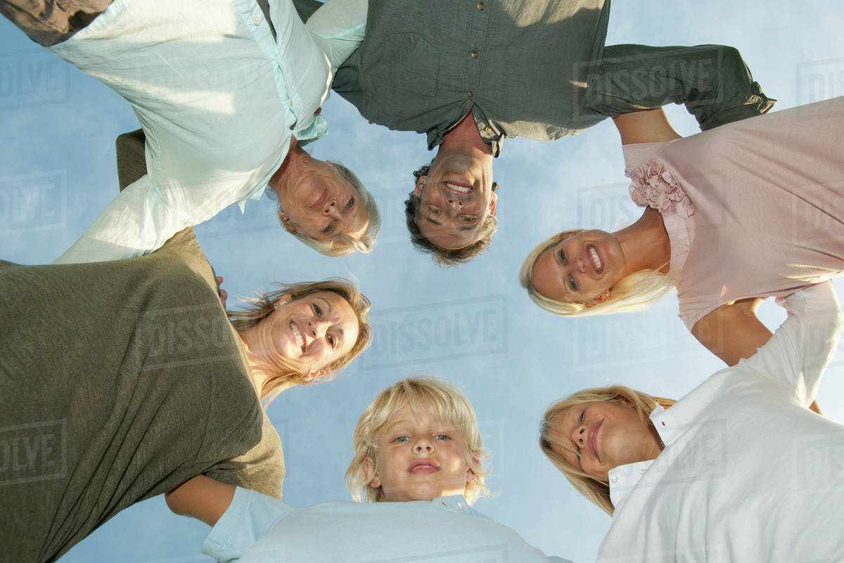 Group huddle, view from below - Royalty-free Stock Photo | Dissolve