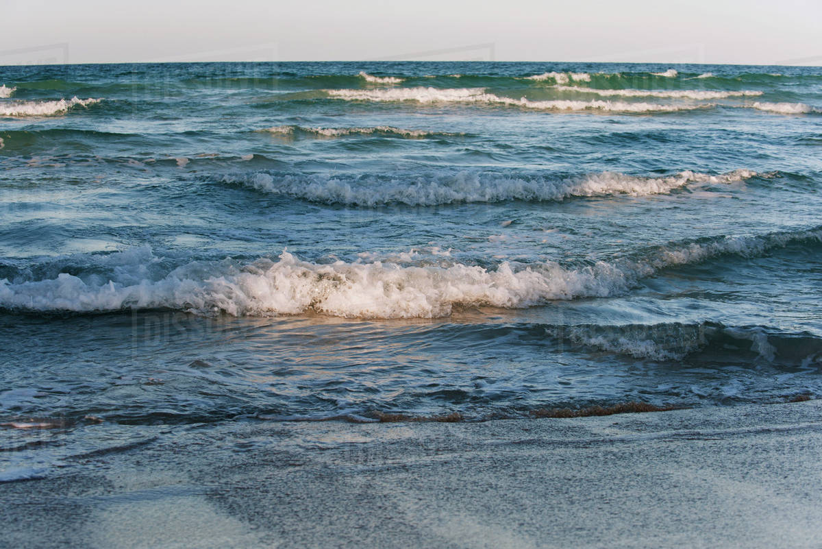 Wave breaking on beach - Stock Photo - Dissolve