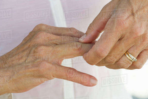 Senior woman rubbing knuckles, cropped - Royalty-free Stock Photo ...