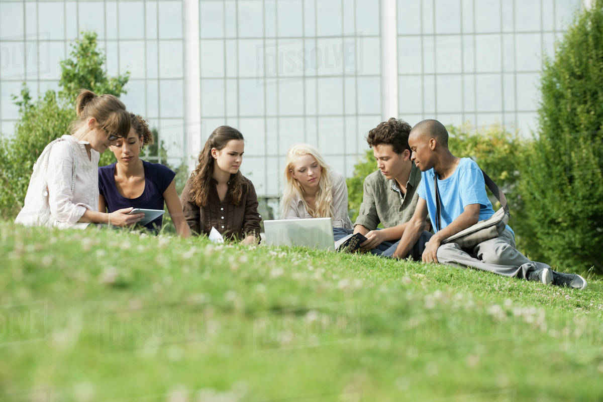 University students studying on grass, low angle veiw - Royalty-free ...