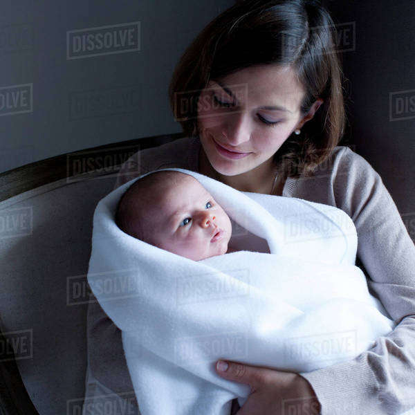 Woman holding newborn baby - Royalty-free Stock Photo | Dissolve
