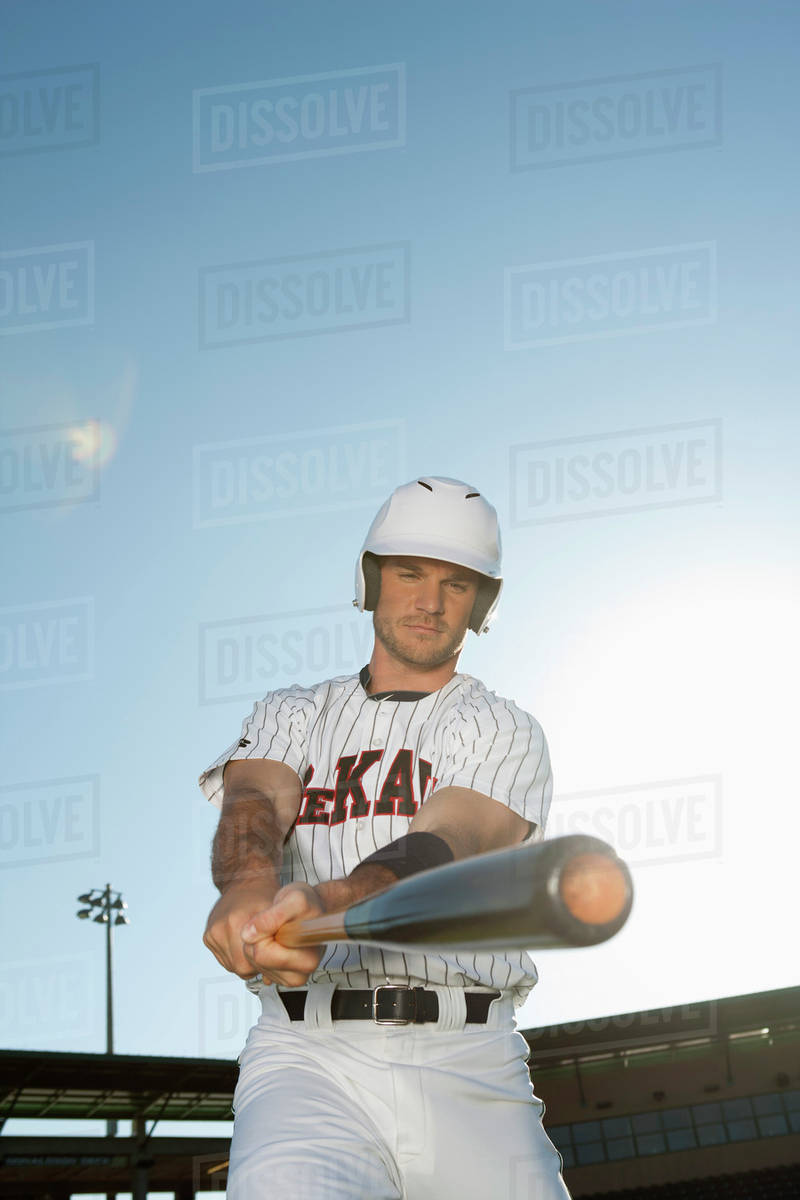 Baseball player swinging bat - Royalty-free Stock Photo | Dissolve