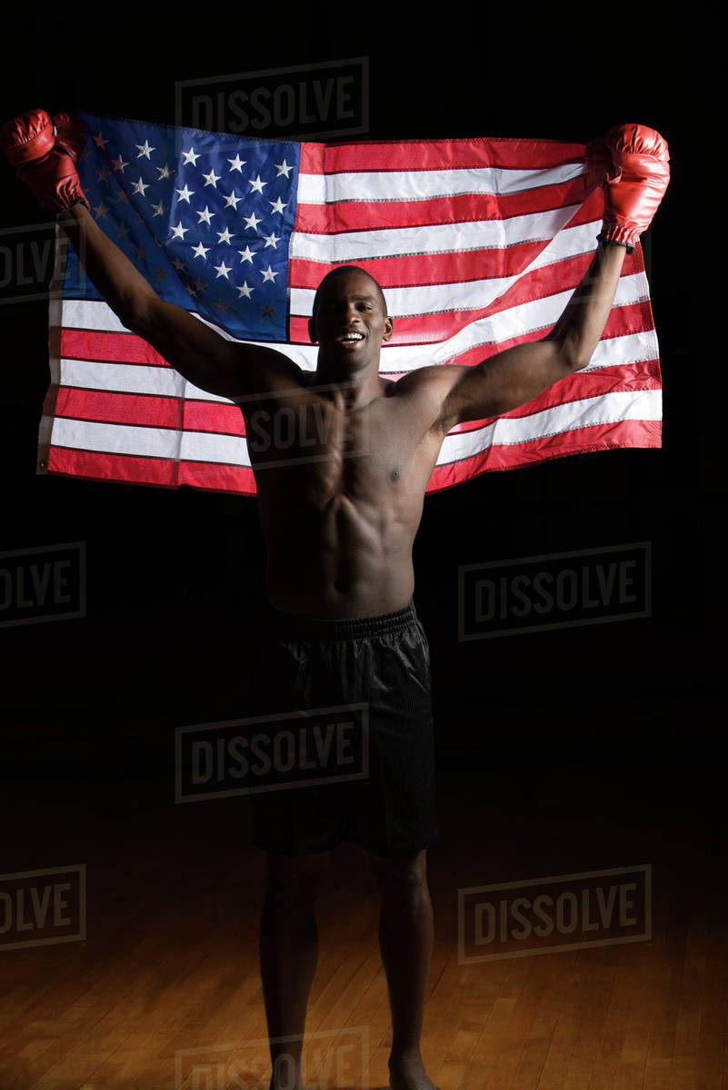 Boxer holding up American flag, portrait - Royalty-free Stock Photo ...