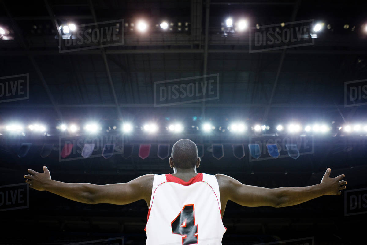 Basketball player with arms outstretched, rear view - Royalty-free ...