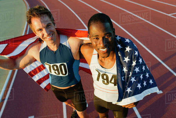 Running teammates holding up American flag after race - Royalty-free ...