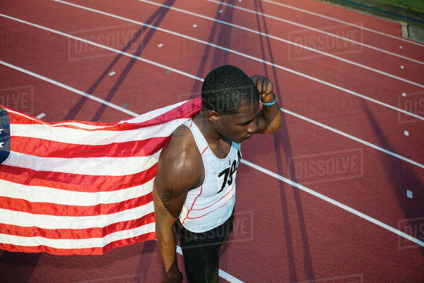Runner holding up American flag after race - Royalty-free Stock Photo ...