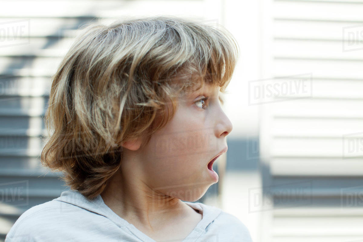 Boy looking away with shocked expression - Royalty-free Stock Photo ...
