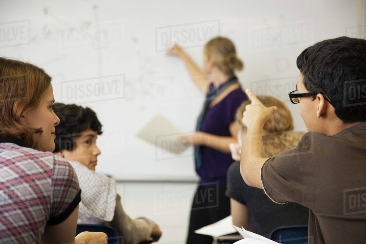 Student explaining concept in class - Royalty-free Stock Photo | Dissolve