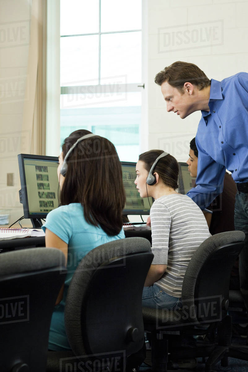 High school students working in computer lab - Stock Photo - Dissolve