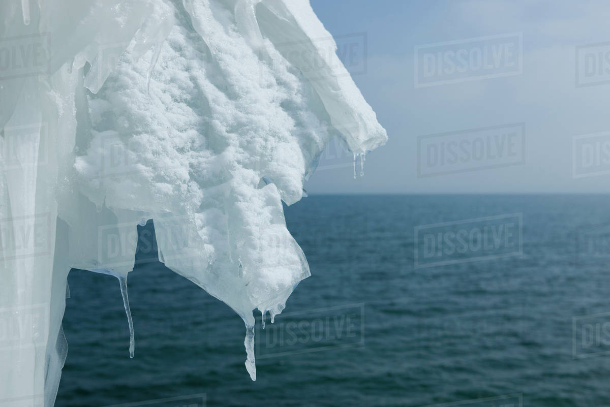 Ice hanging over lake - Stock Photo - Dissolve