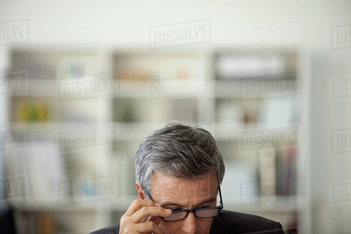 Mature man adjusting reading glasses, cropped - Royalty-free Stock ...