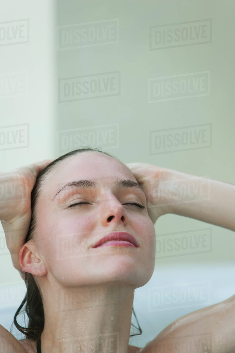 Woman bathing with eyes closes - Royalty-free Stock Photo | Dissolve
