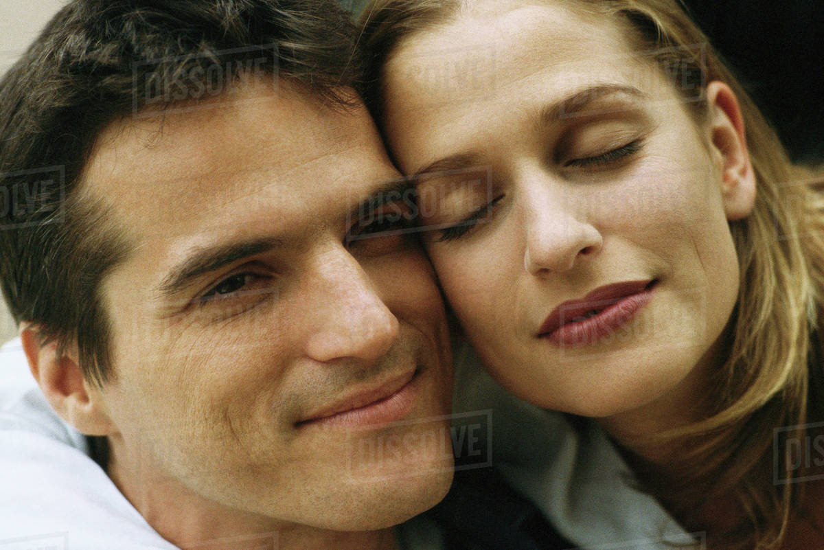 Couple cheek to cheek, smiling, close-up - Stock Photo - Dissolve