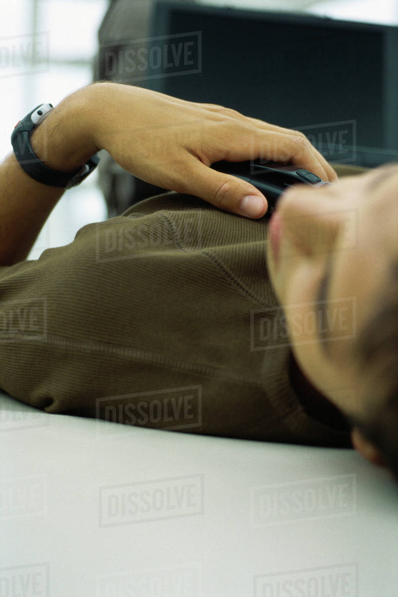 Man napping with laptop computer on lap, close-up, cropped view ...