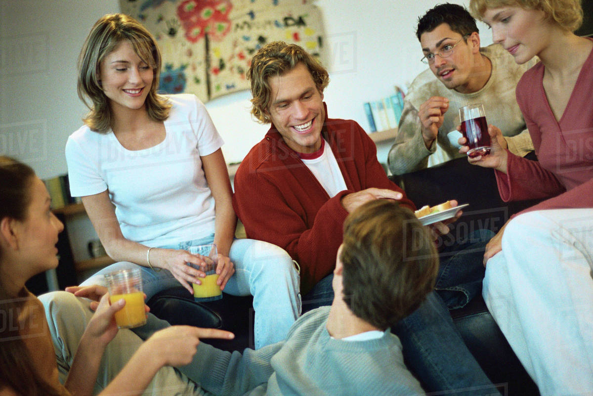 Gathering of friends at house party - Royalty-free Stock Photo | Dissolve