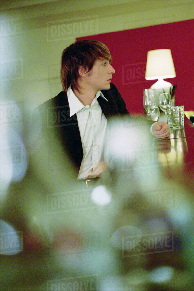 Well dressed young man at bar - Royalty-free Stock Photo | Dissolve