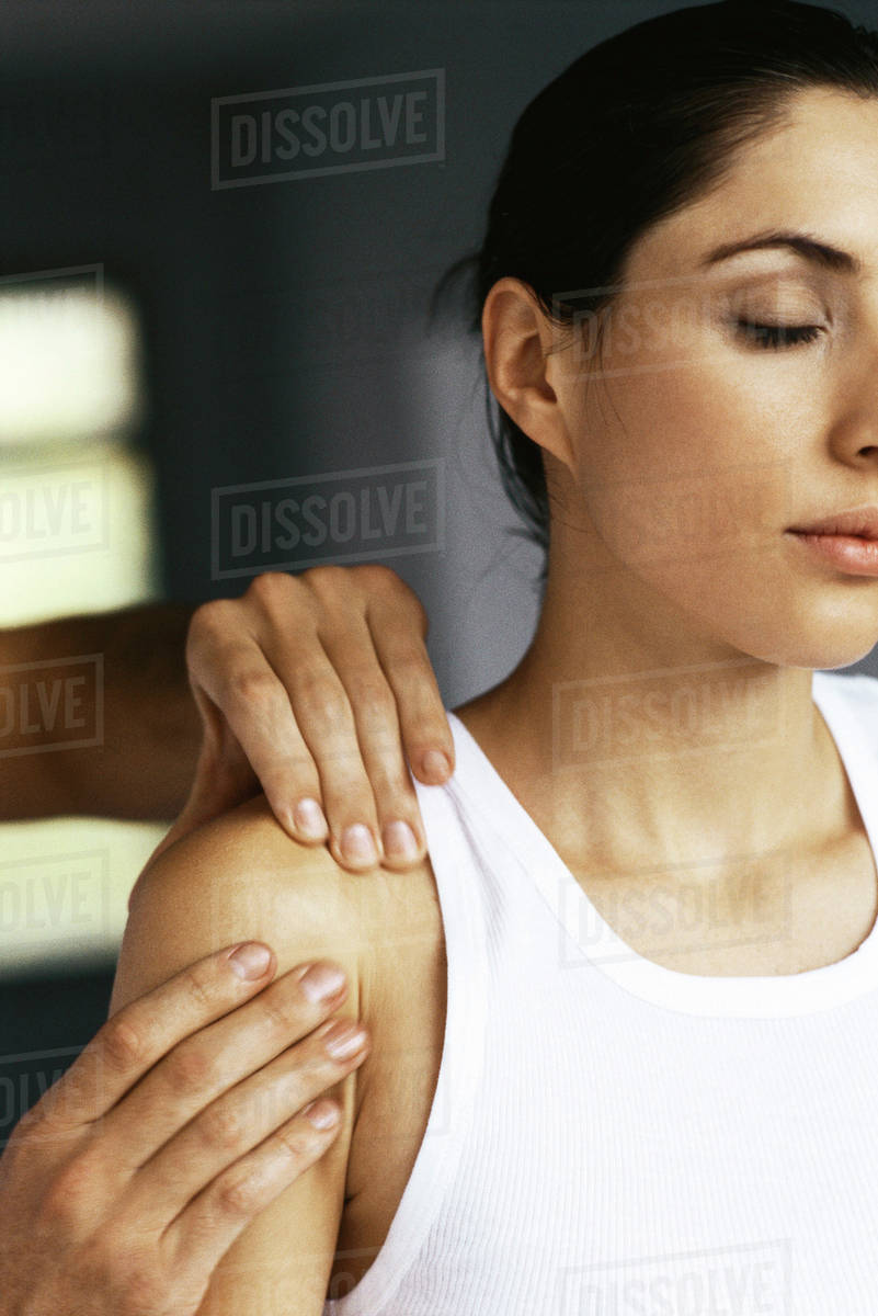 Woman having shoulder massaged - Royalty-free Stock Photo | Dissolve