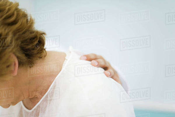 Patient being consoled by doctor, head down, cropped - Stock Photo ...