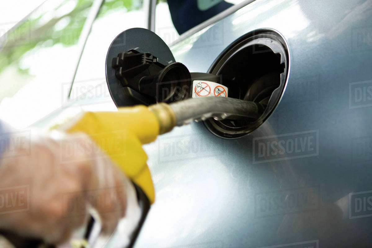 Refueling vehicle at gas station - Stock Photo - Dissolve