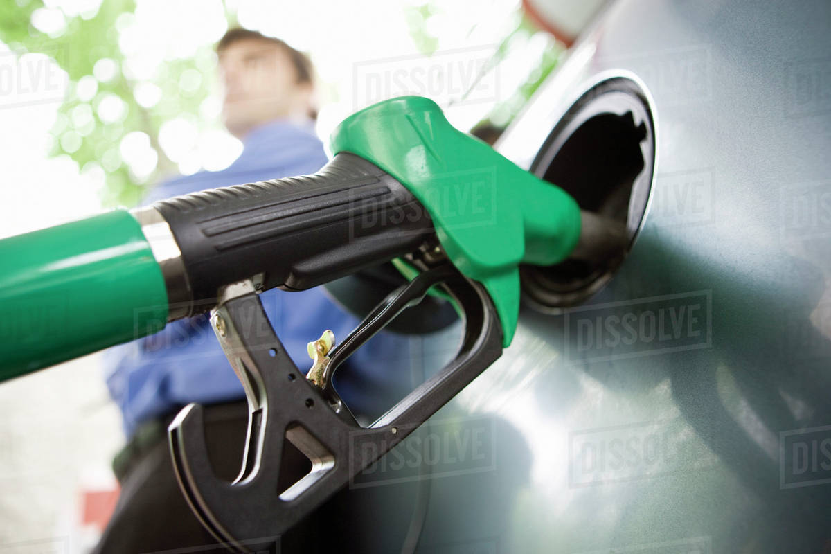 Refueling vehicle at gas station - Royalty-free Stock Photo | Dissolve
