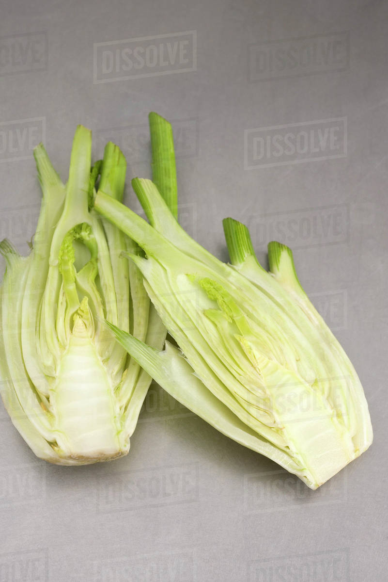 Fresh fennel bulb, cut in half - Stock Photo - Dissolve