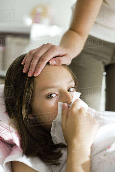 Girl with head cold, mother caressing forehead - Royalty-free Stock ...
