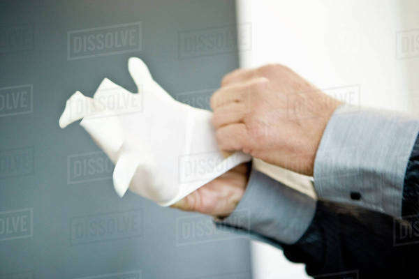 Doctor putting on latex gloves, cropped - Royalty-free Stock Photo ...