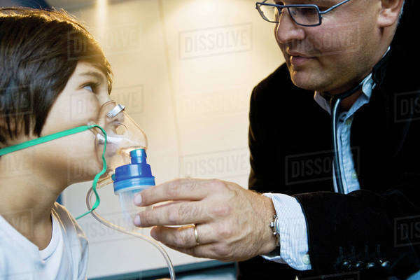 Boy receiving oxygen treatment - Royalty-free Stock Photo | Dissolve