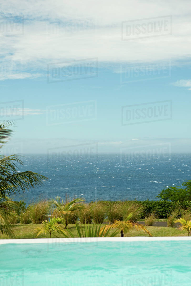 Swimming pool with view of sea at resort - Royalty-free Stock Photo ...