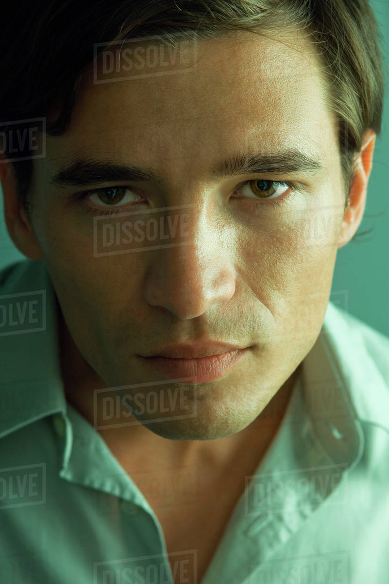 Man staring at camera, close-up - Stock Photo - Dissolve