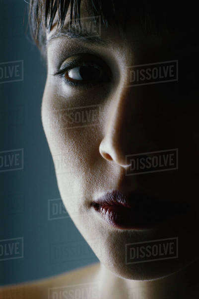 Woman's face in shadow, close-up - Royalty-free Stock Photo | Dissolve
