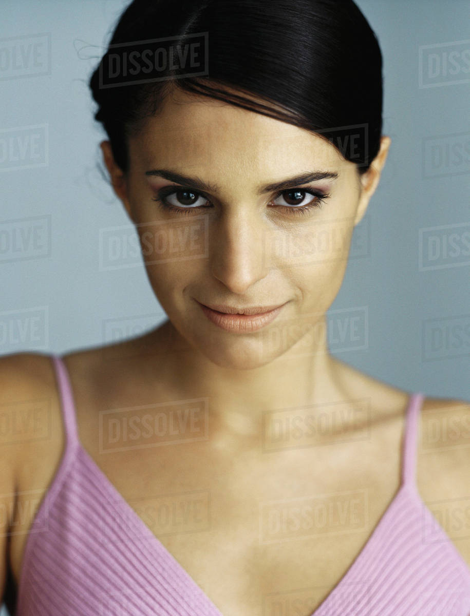 Woman staring at camera, smiling, portrait - Royalty-free Stock Photo ...
