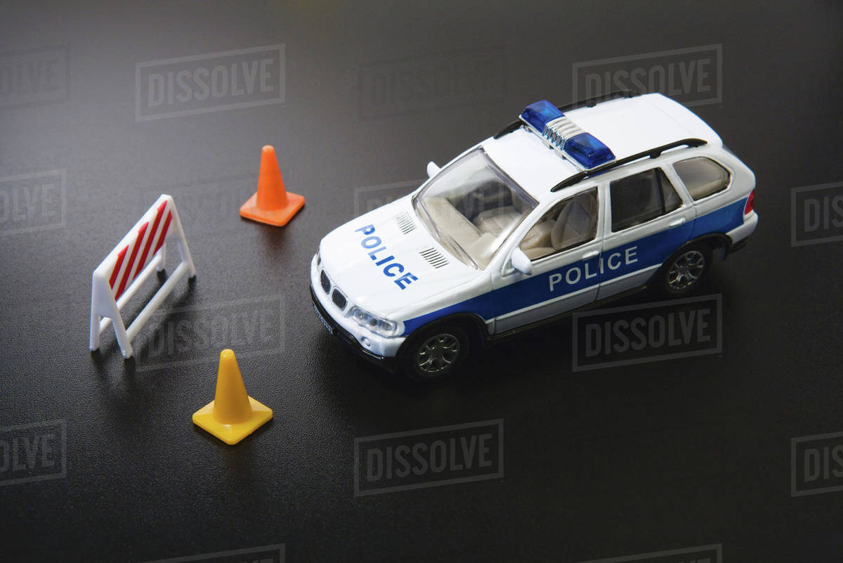 Toy police car and traffic cones, close-up - Royalty-free Stock Photo ...