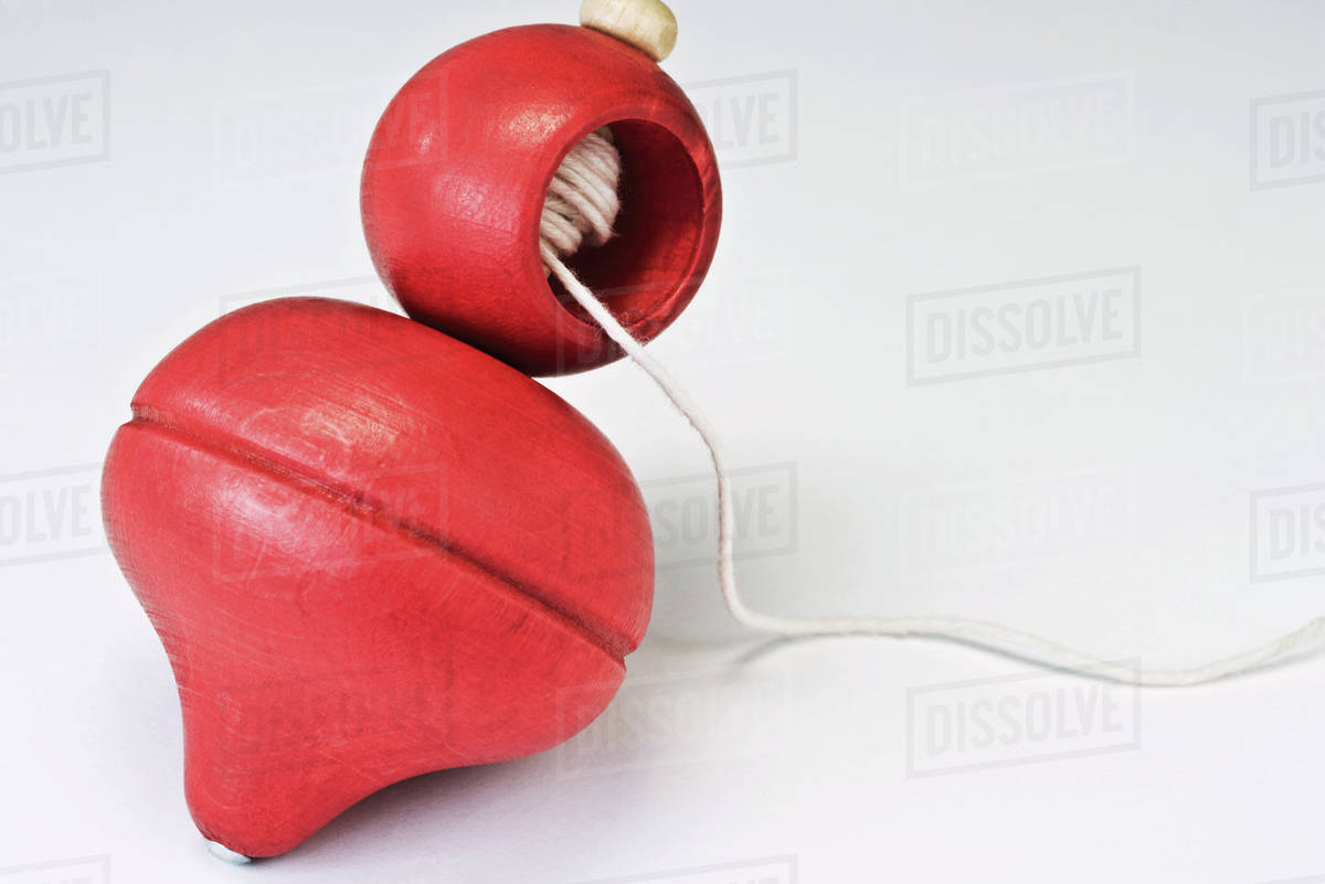 Wooden toy top, close-up - Royalty-free Stock Photo | Dissolve