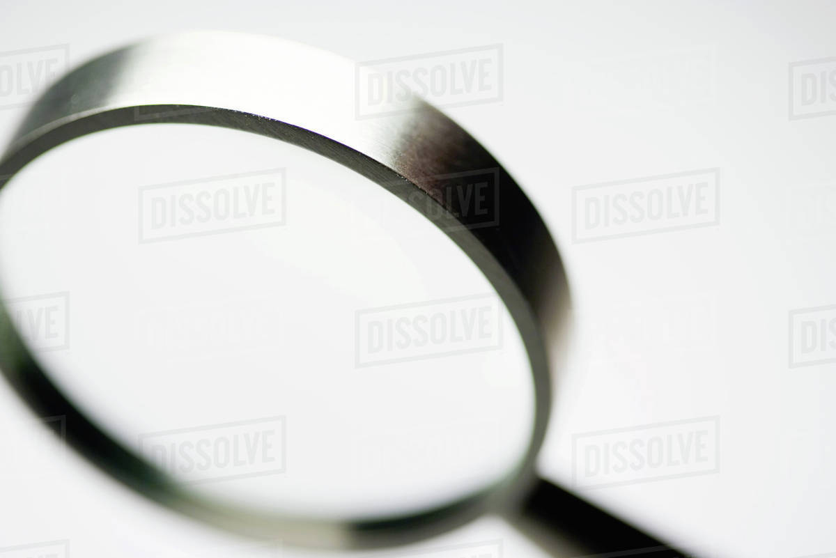 Magnifying glass, close-up, cropped - Royalty-free Stock Photo | Dissolve