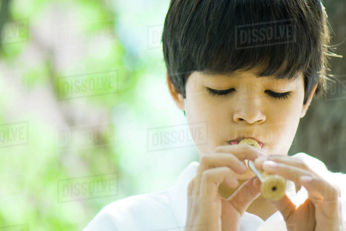 Boy playing recorder - Royalty-free Stock Photo | Dissolve