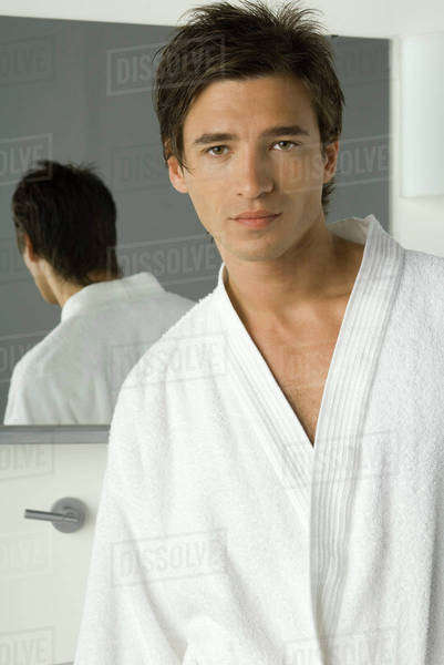 Man wearing bathrobe, looking at camera, portrait - Royalty-free Stock ...