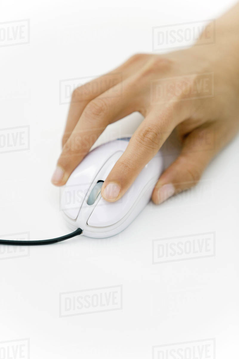 Hand using computer mouse, close-up - Royalty-free Stock Photo | Dissolve