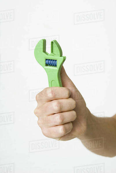 Hand holding wrench - Royalty-free Stock Photo | Dissolve