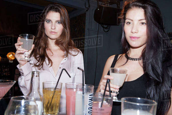 Women drinking in nightclub - Royalty-free Stock Photo | Dissolve