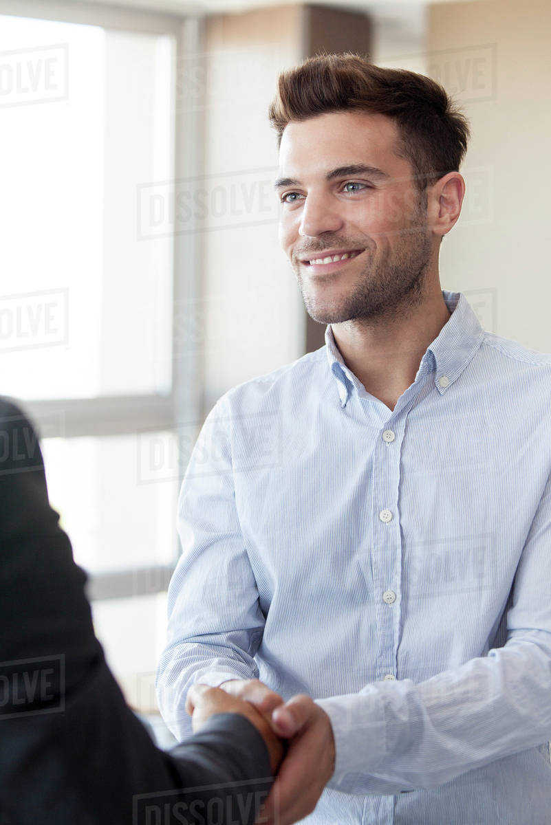 Client shaking hands with businessman - Royalty-free Stock Photo | Dissolve