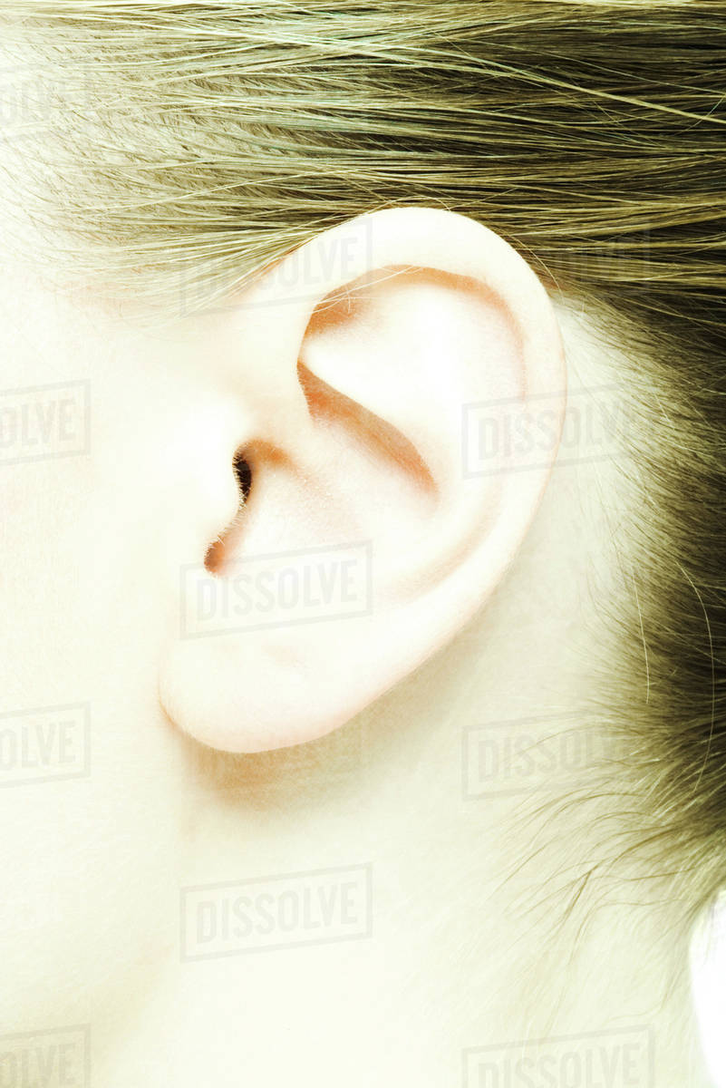 Teenage girl's ear, extreme close-up - Royalty-free Stock Photo | Dissolve