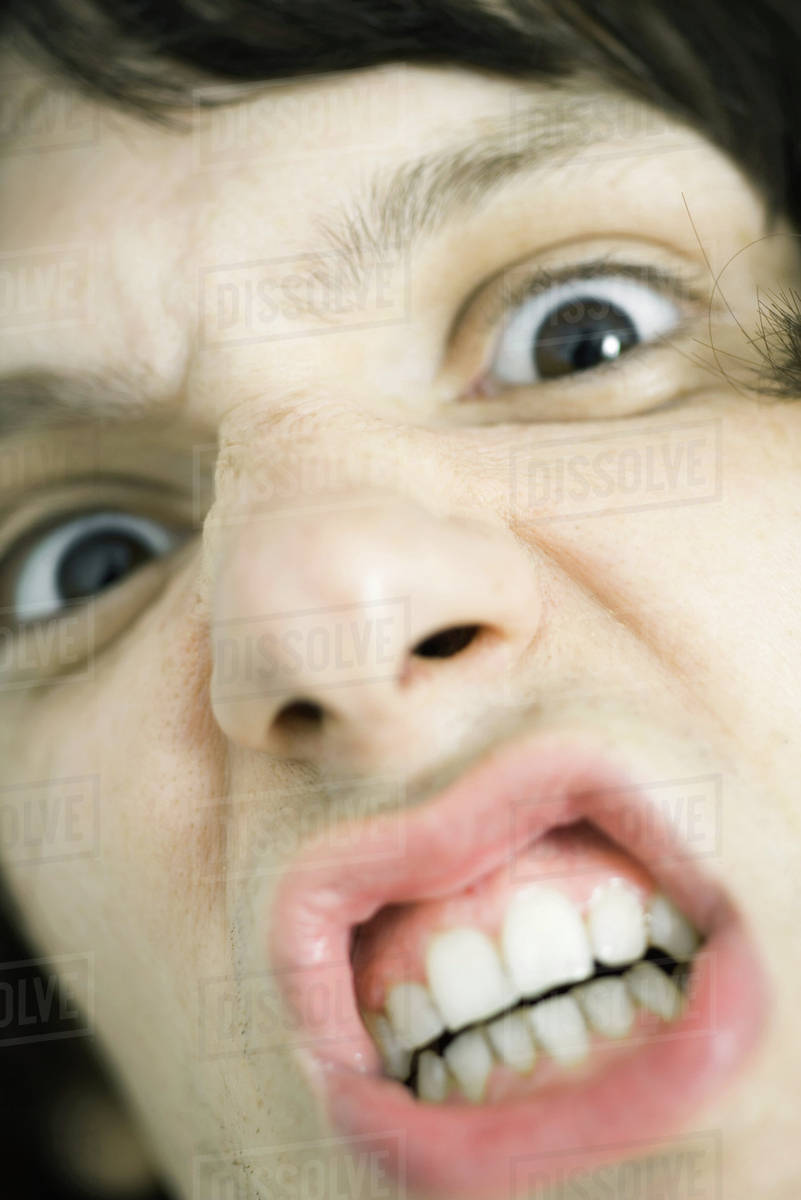 Teen boy making angry face, extreme close-up - Royalty-free Stock Photo ...