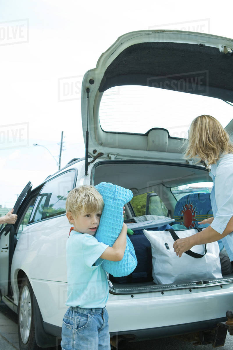 Family unloading trunk of car - Royalty-free Stock Photo | Dissolve